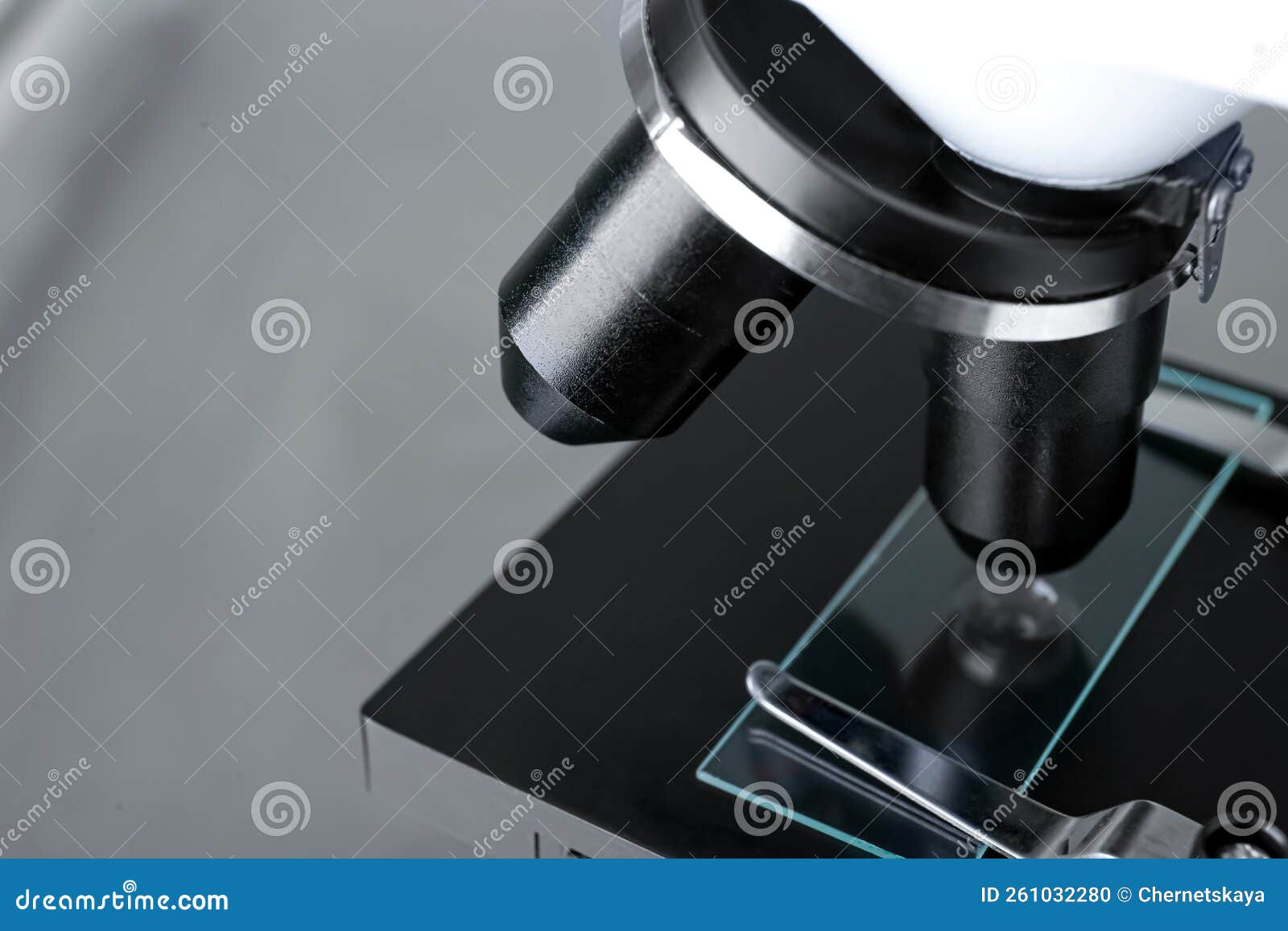 Modern Medical Microscope with Glass Slide on Grey Background, Closeup ...