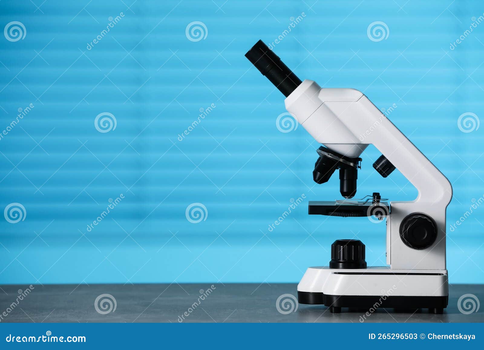 Modern Medical Microscope on Grey Table Indoors, Space for Text Stock ...