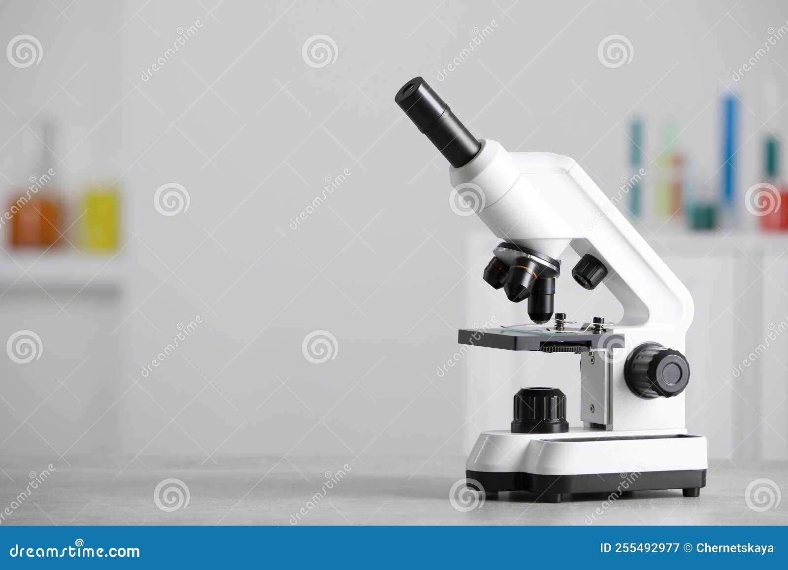 Modern Medical Microscope on Grey Table in Laboratory, Space for Text ...