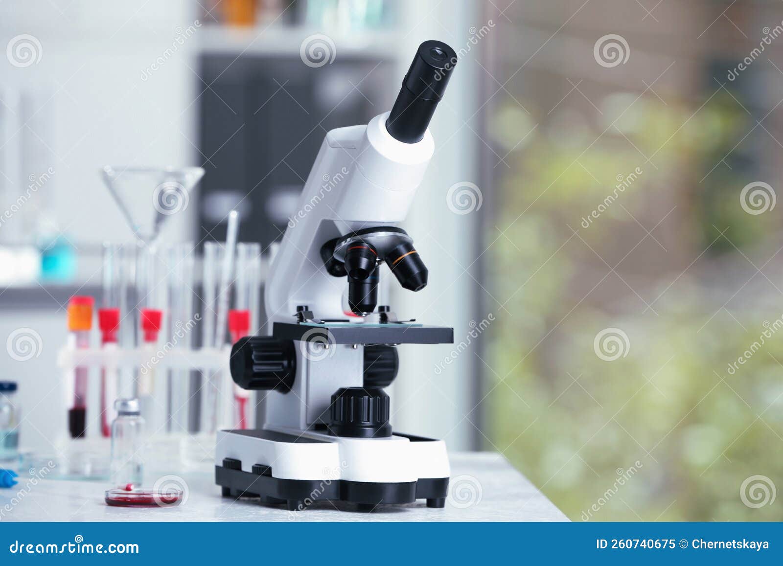 Modern Medical Microscope on Light Gray Table in Laboratory. Space for ...