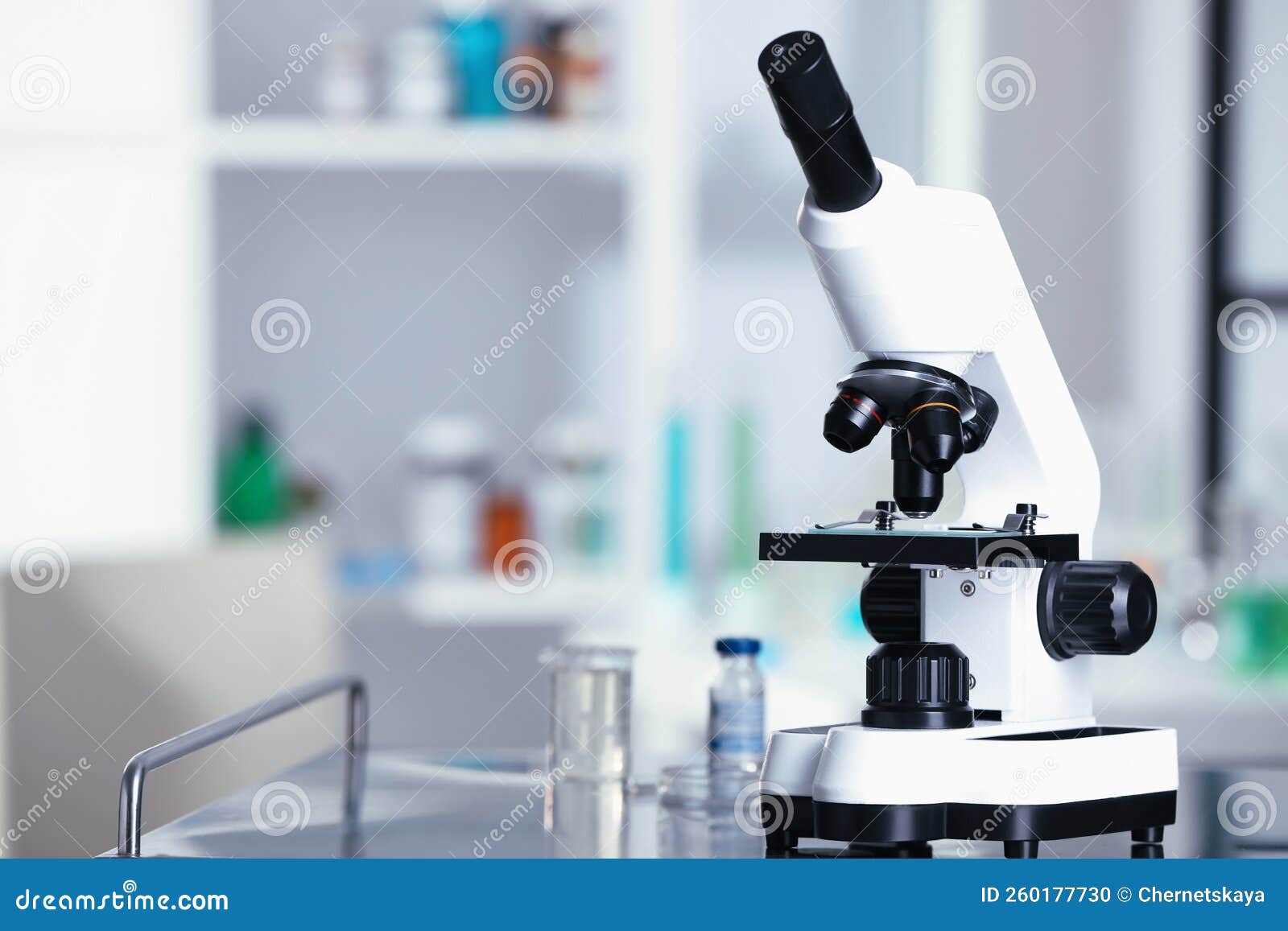 Modern Medical Microscope on Metal Table in Laboratory, Space for Text ...