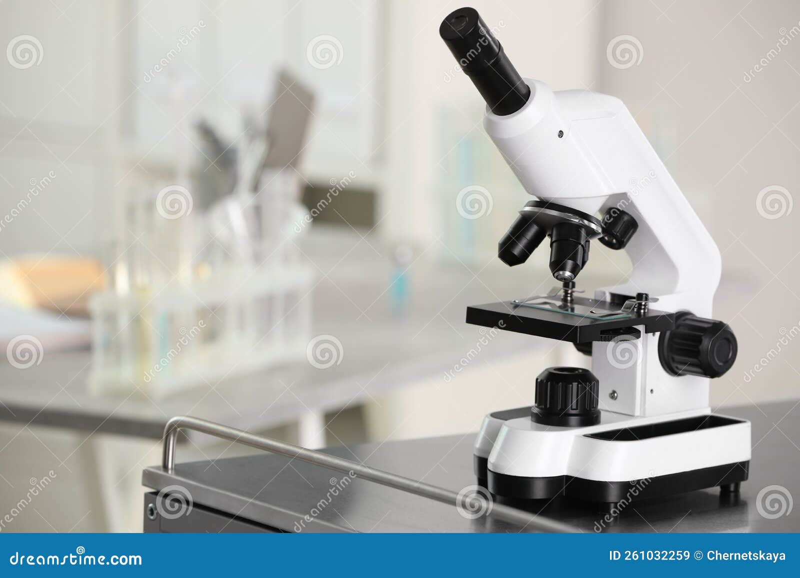 Modern Medical Microscope on Metal Table in Laboratory, Space for Text ...