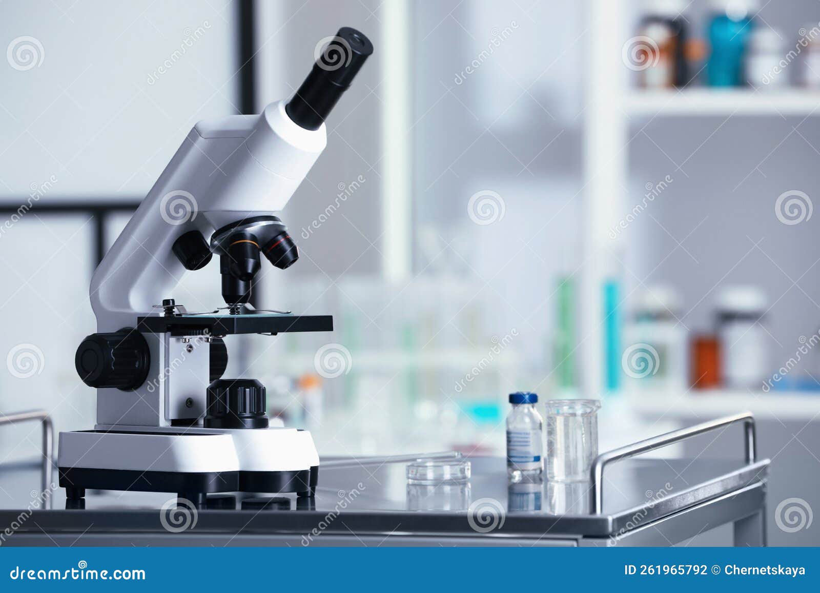 Modern Medical Microscope on Metal Table in Laboratory, Space for Text ...
