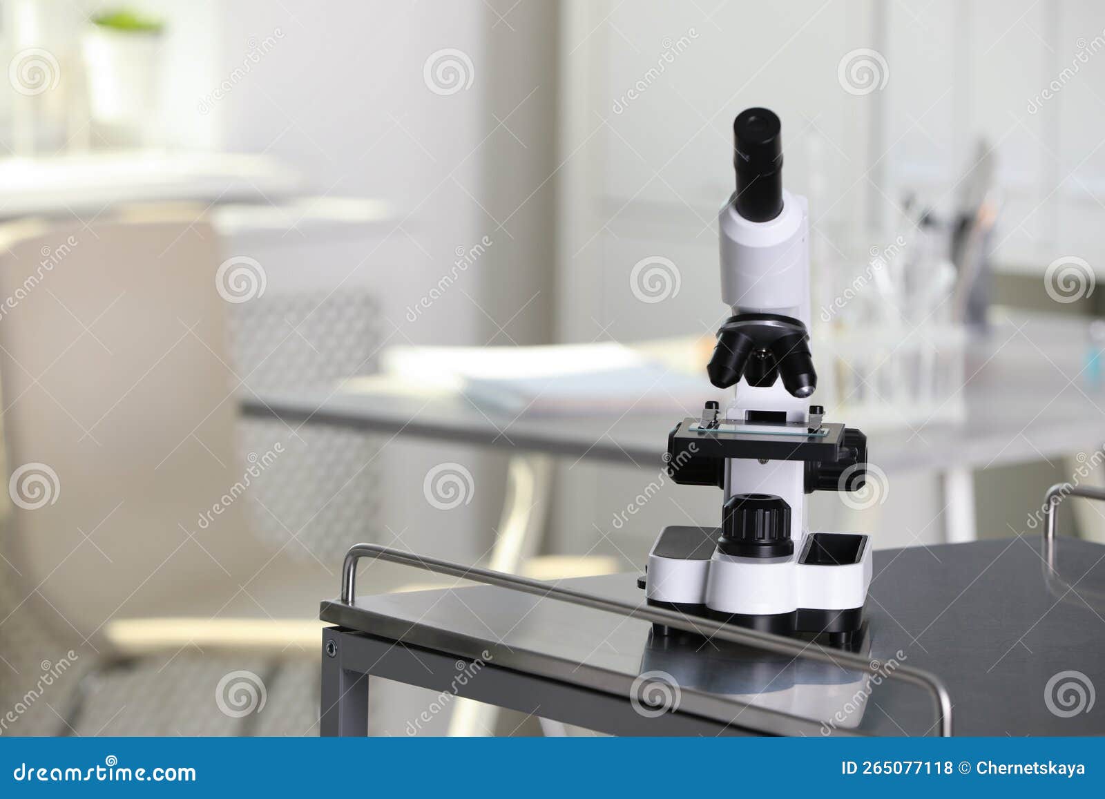 Modern Medical Microscope on Metal Table in Laboratory, Space for Text ...