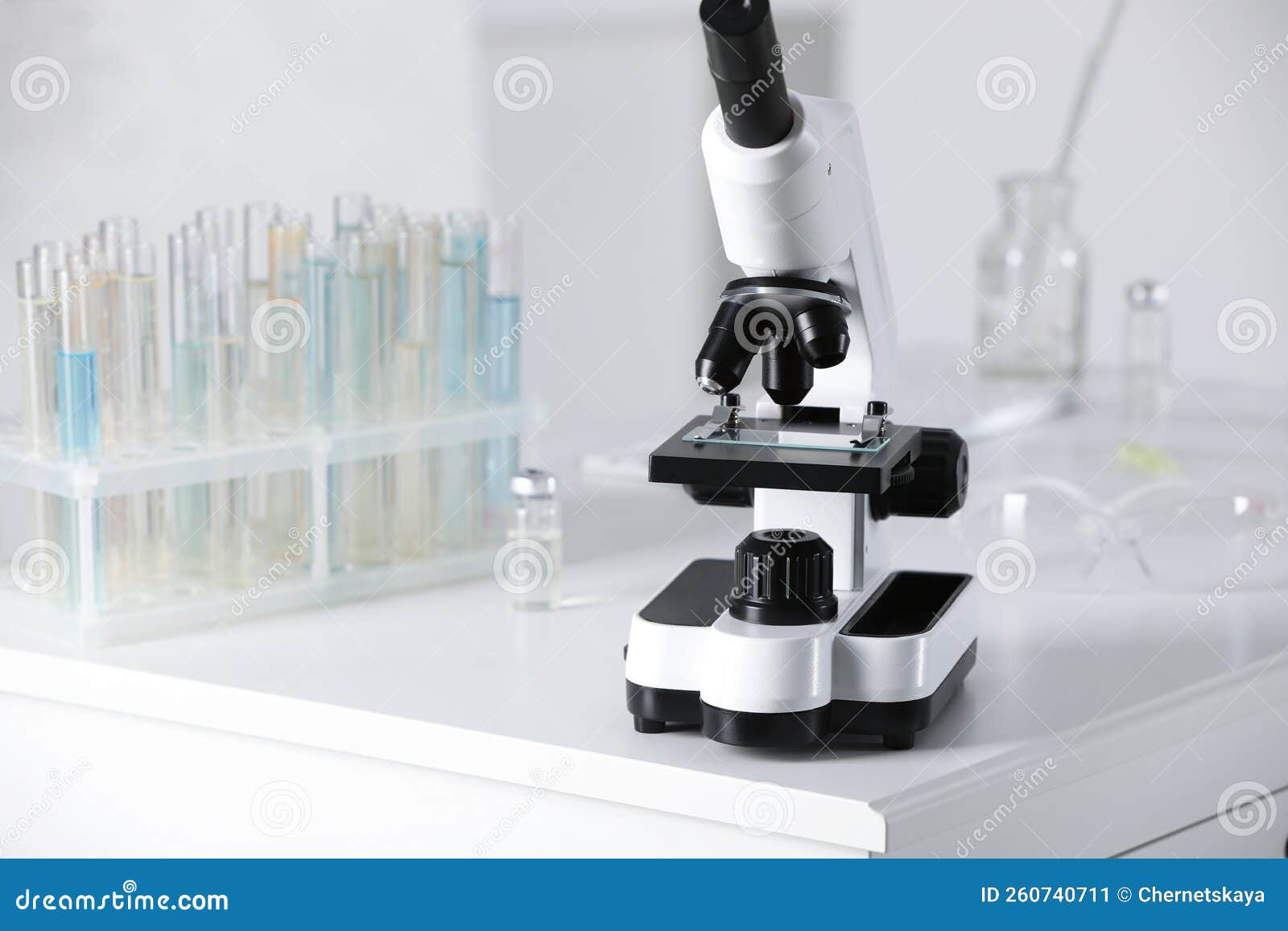 Modern Medical Microscope on White Table in Laboratory, Space for Text ...
