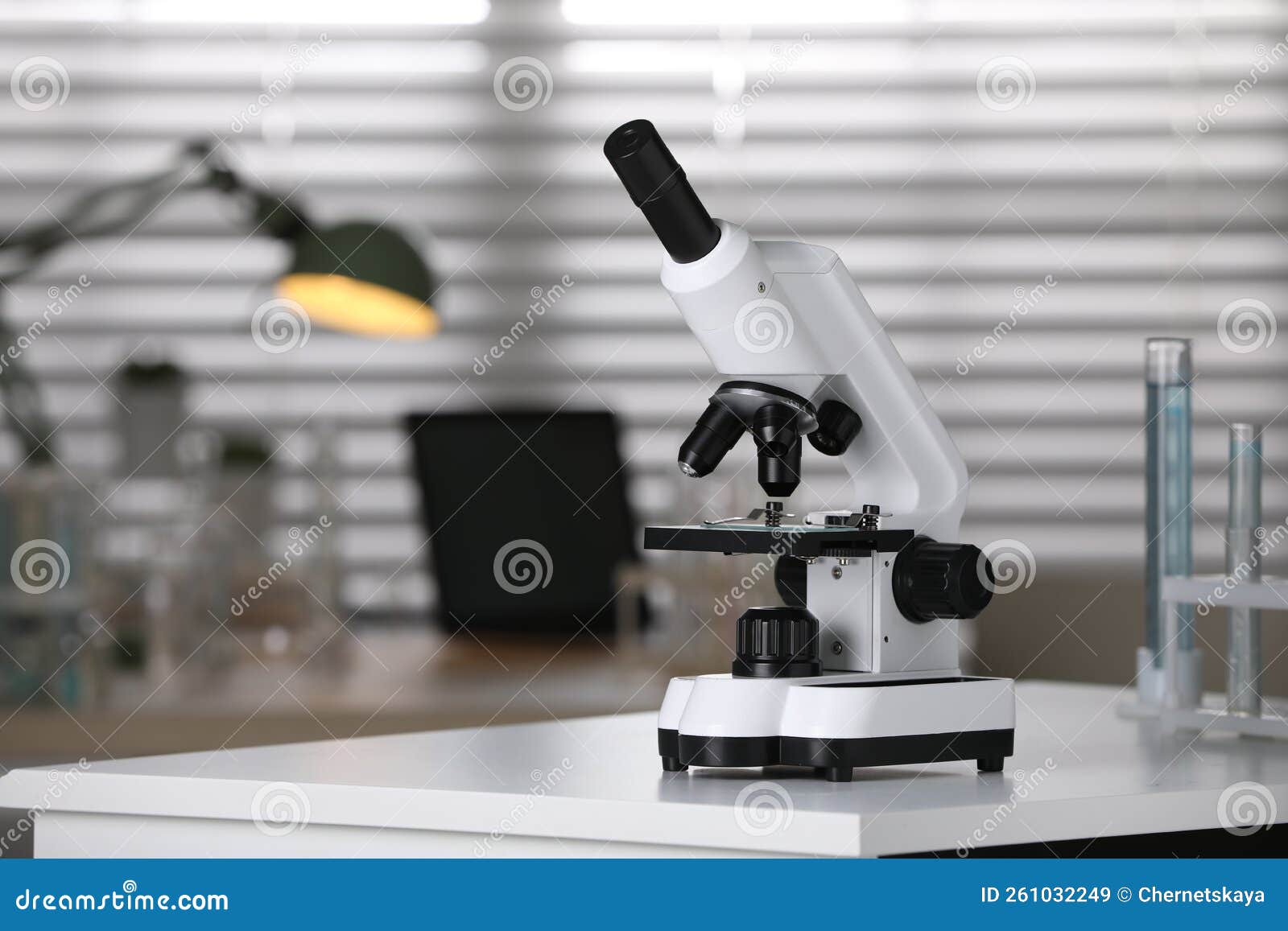 Modern Medical Microscope on White Table in Laboratory, Space for Text ...
