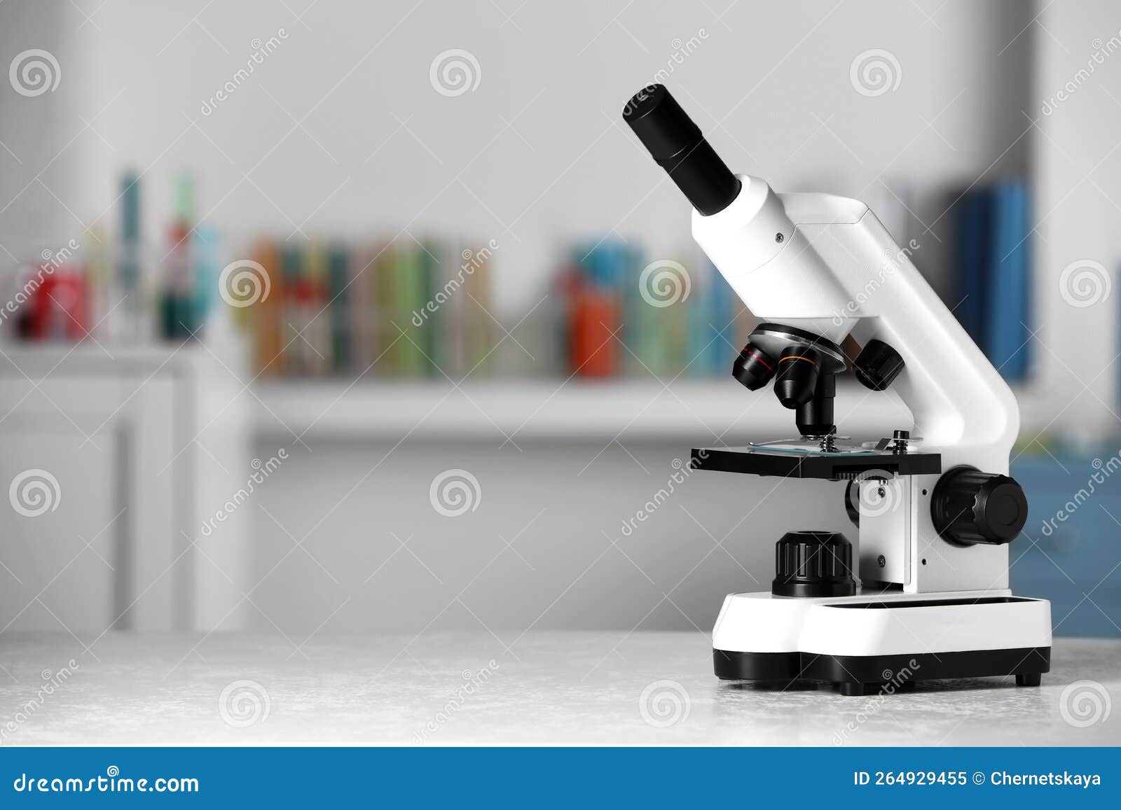 Modern Medical Microscope on White Table in Laboratory, Space for Text ...