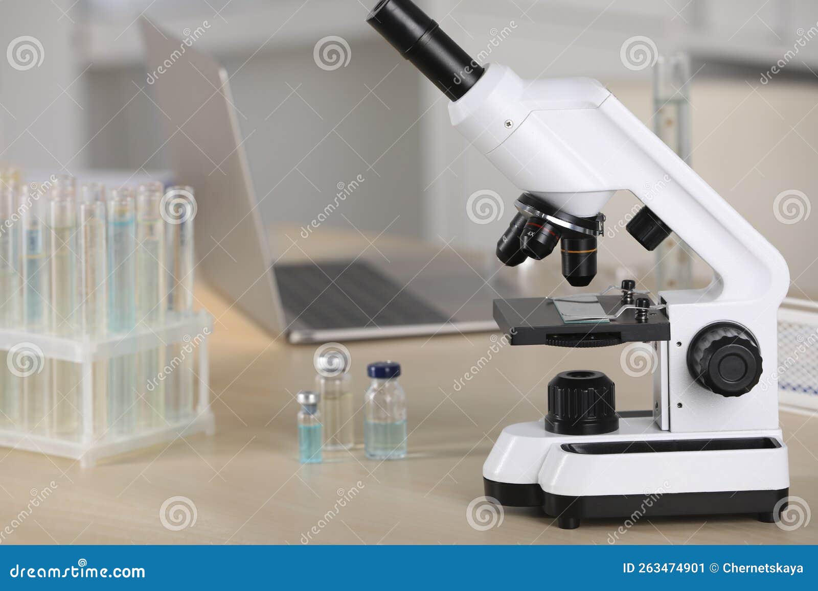 Modern Medical Microscope on Wooden Table in Laboratory, Space for Text ...