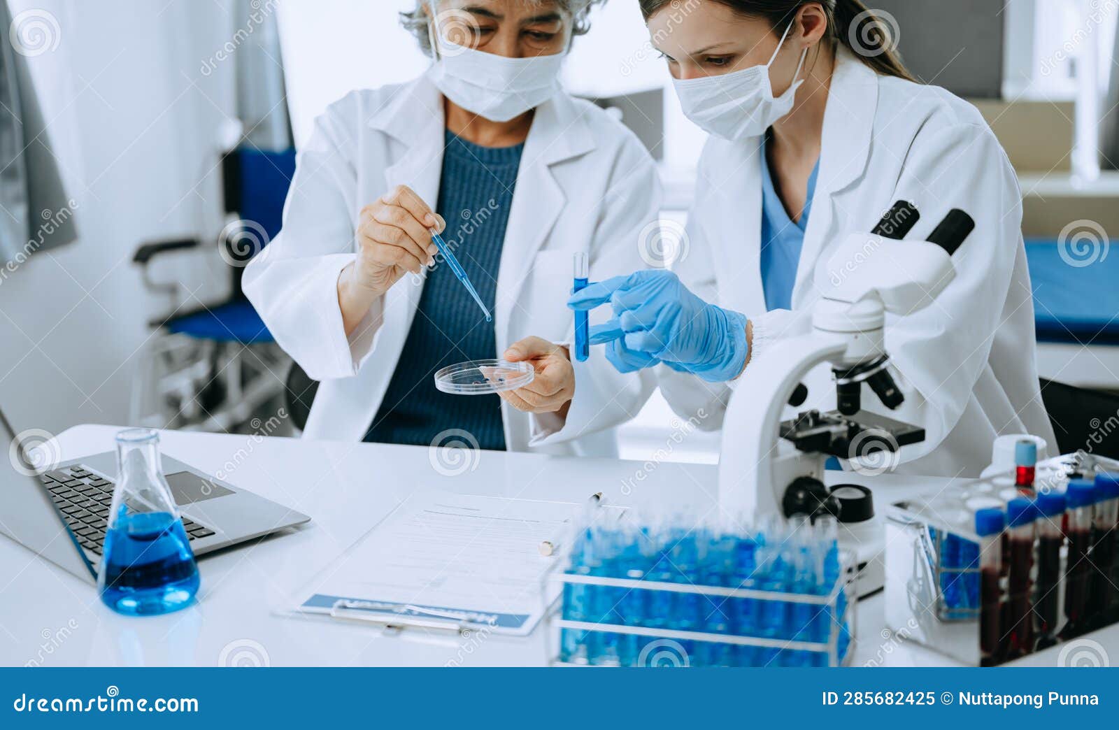 Modern Medical Research Laboratory. Female Scientist Working with Micro ...