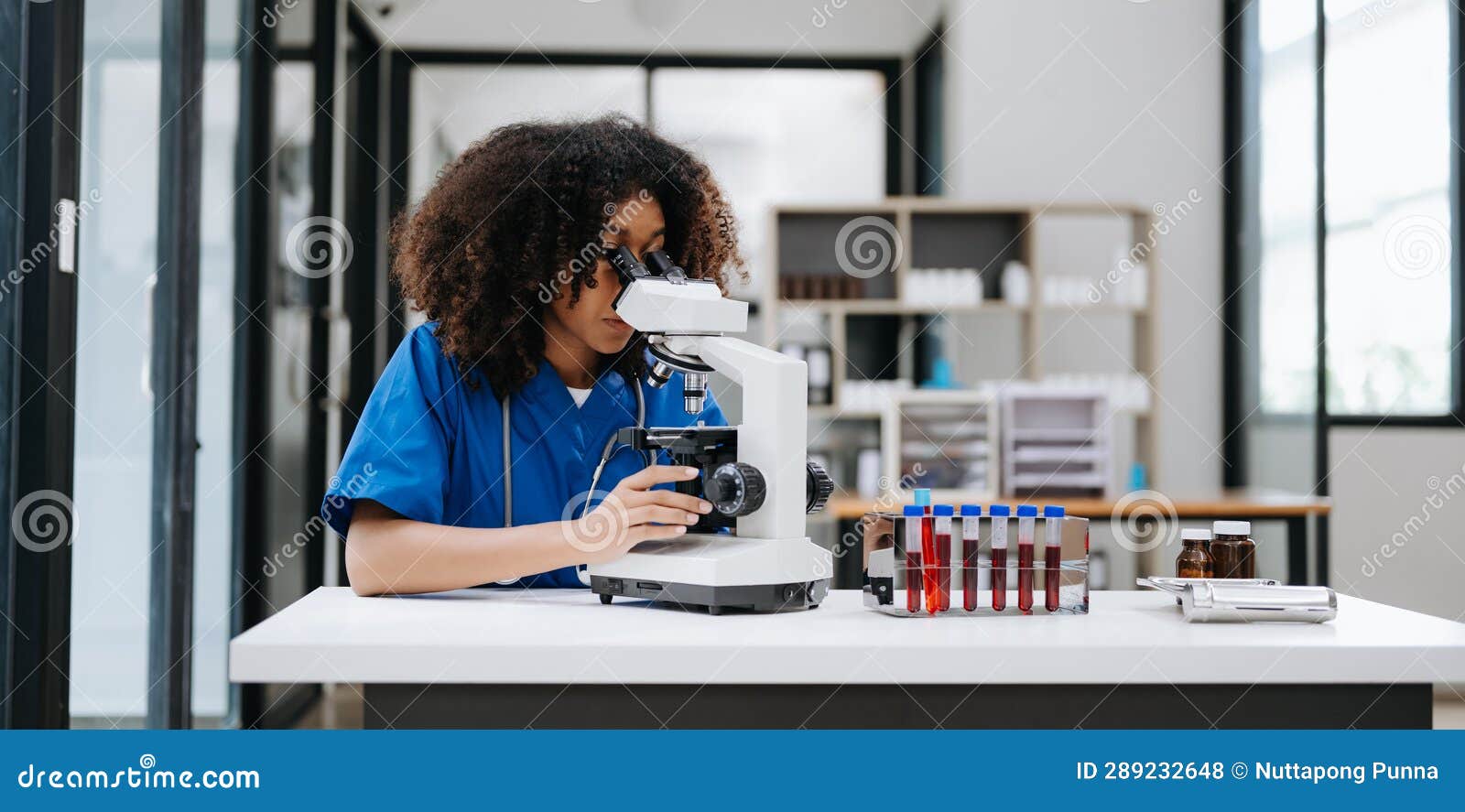 Modern Medical Research Laboratory. Female Scientist Working with Micro ...