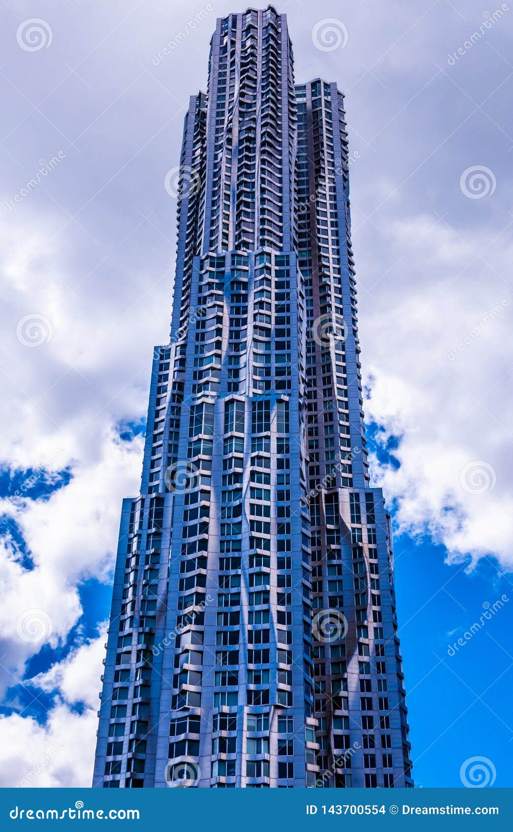Modern Metallic Shiny Skyscraper with Wavy Shape Facade and Cloudy Blue ...