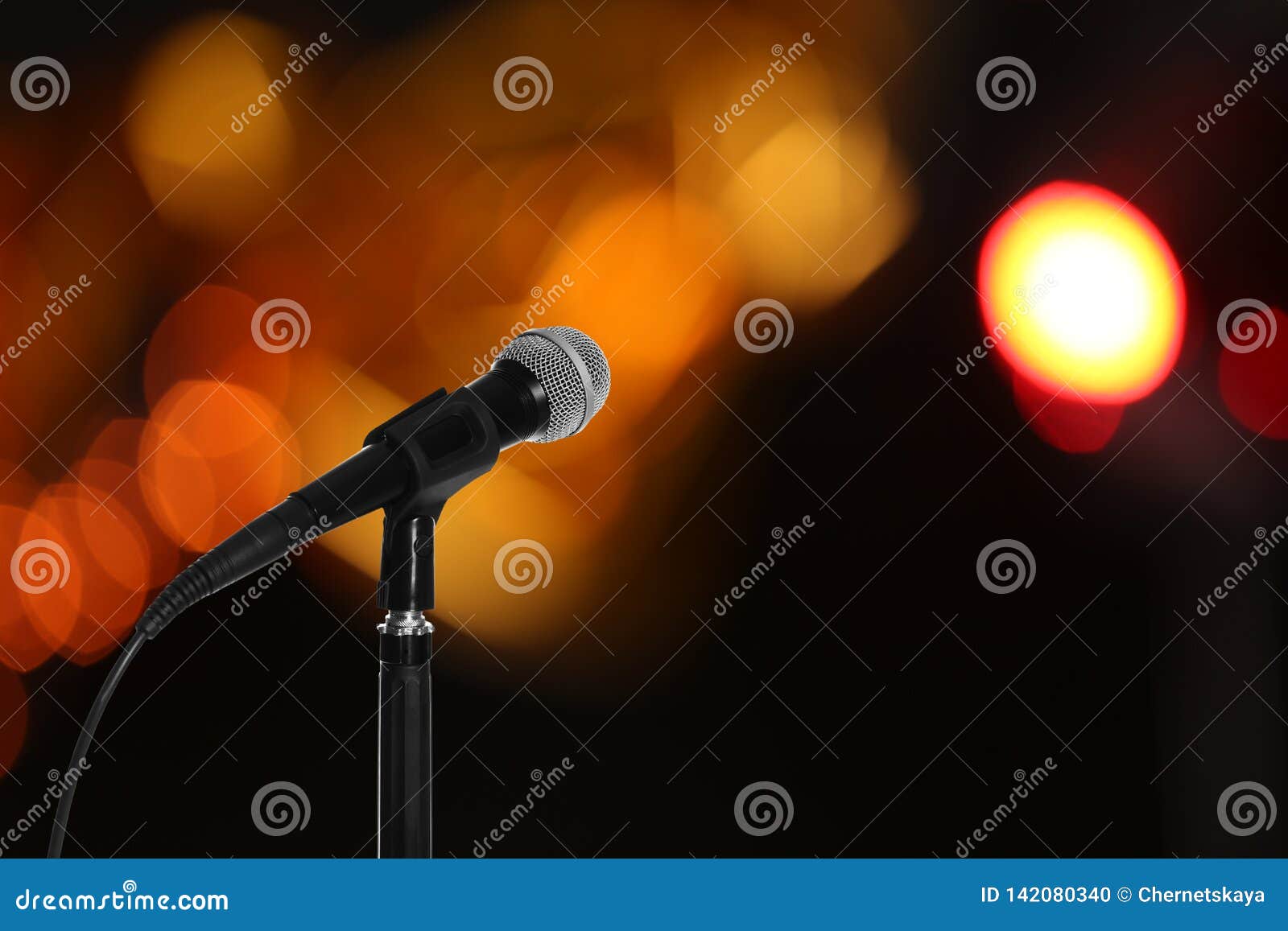 Modern Microphone on Stand Against Blurred Background Stock Photo ...