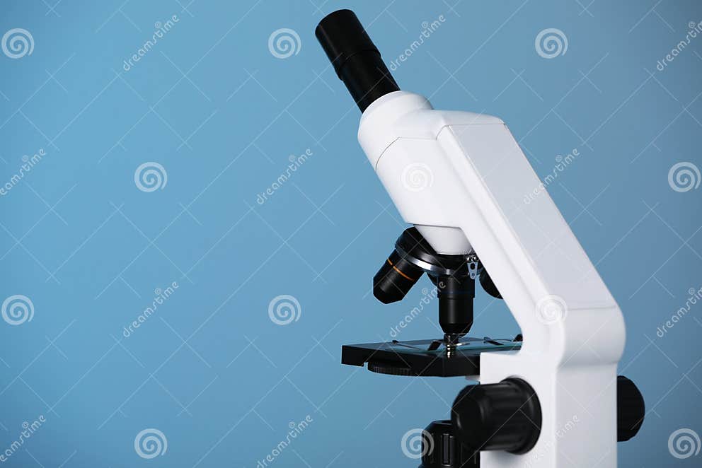 Modern Microscope on Blue Background. Space for Text Stock Photo ...