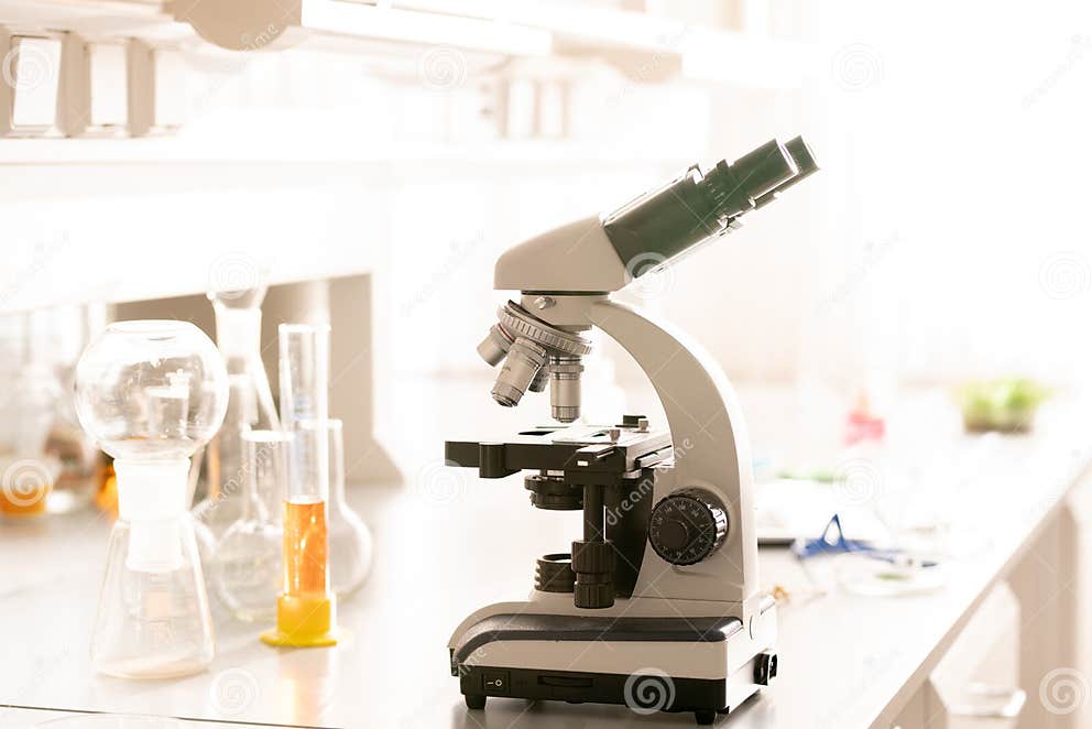 Modern microscope on desk stock photo. Image of science - 146271124