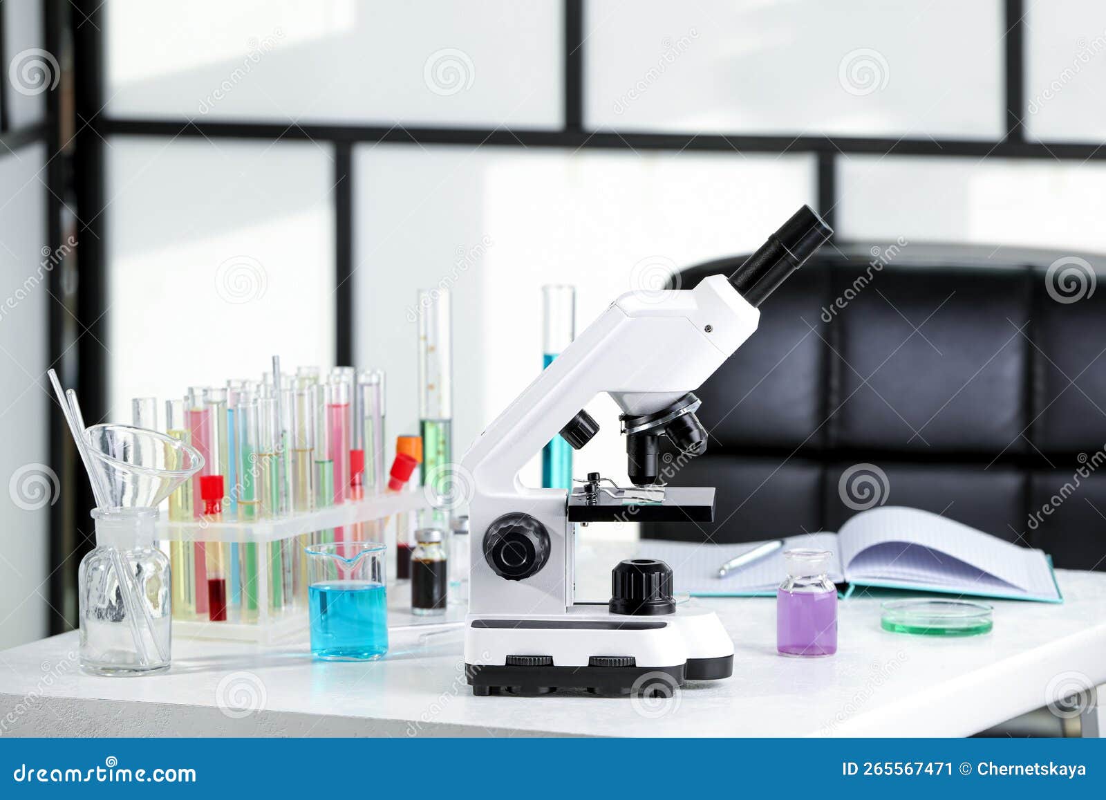 Modern Microscope with Glass Slide on White Table in Laboratory Stock ...