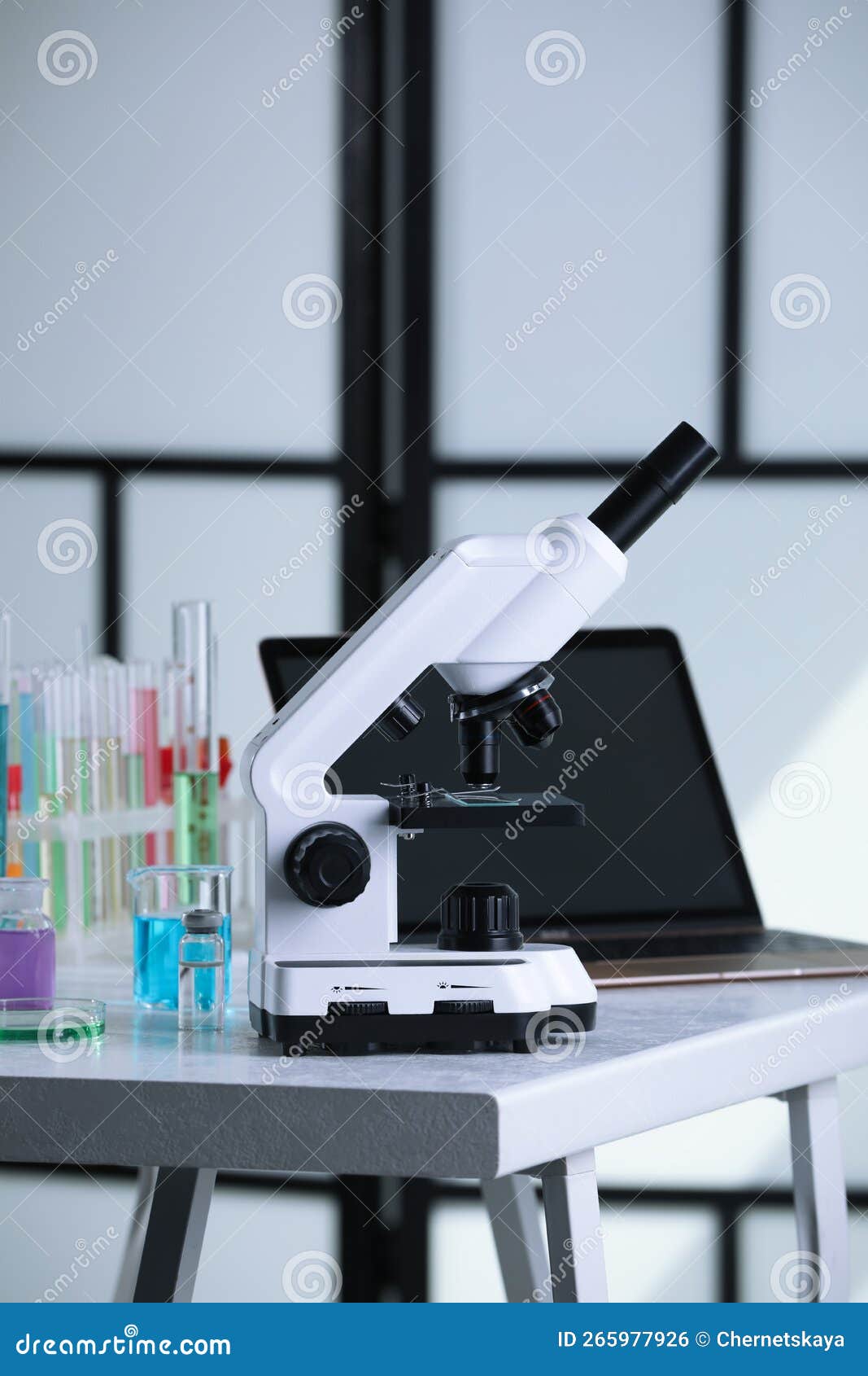 Modern Microscope with Glass Slide on White Table in Laboratory Stock ...