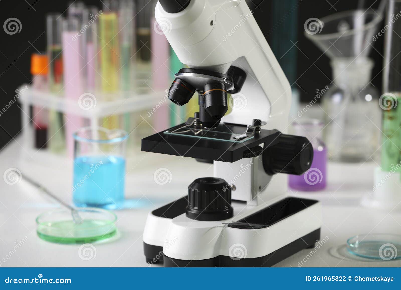 Modern Microscope with Glass Slide on White Table in Laboratory ...