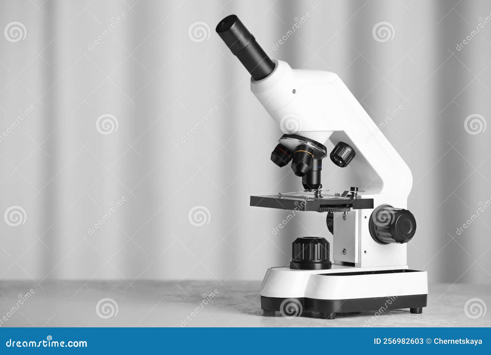 Modern Microscope on Table Indoors. Space for Text Stock Image - Image ...