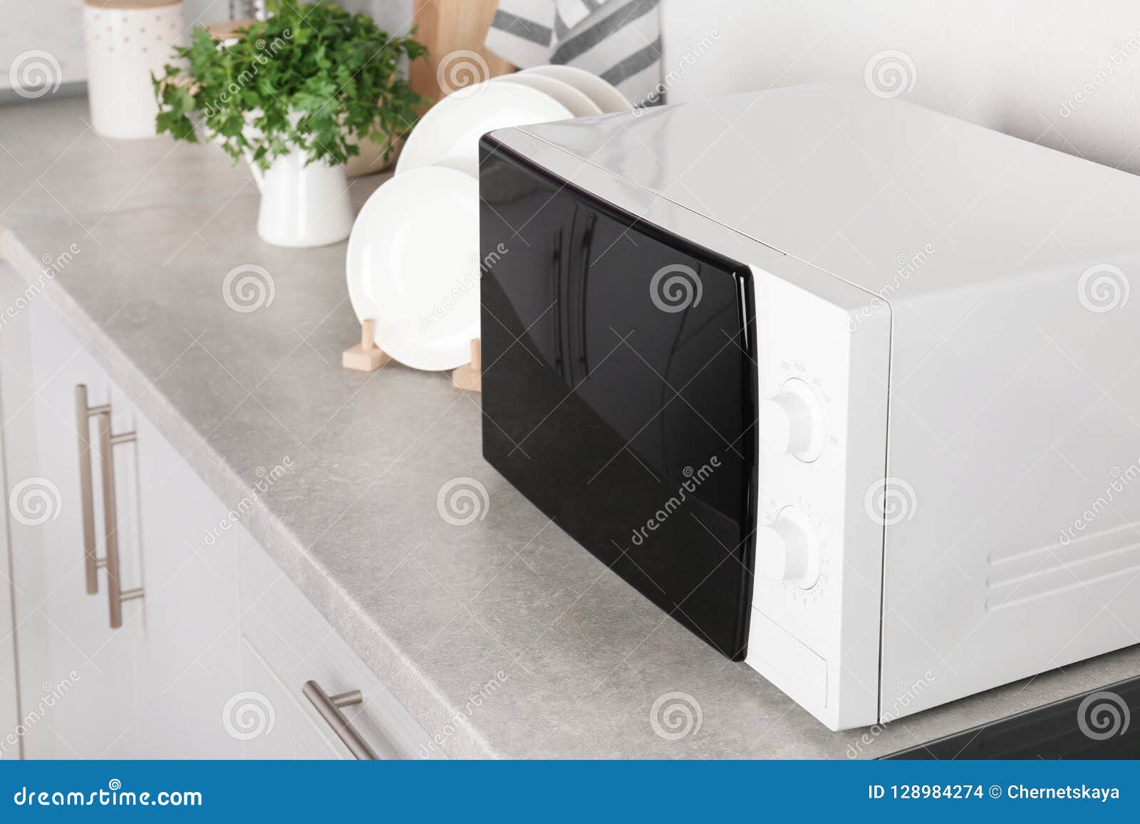 Modern Microwave Oven on Table Stock Photo - Image of food, cooking ...