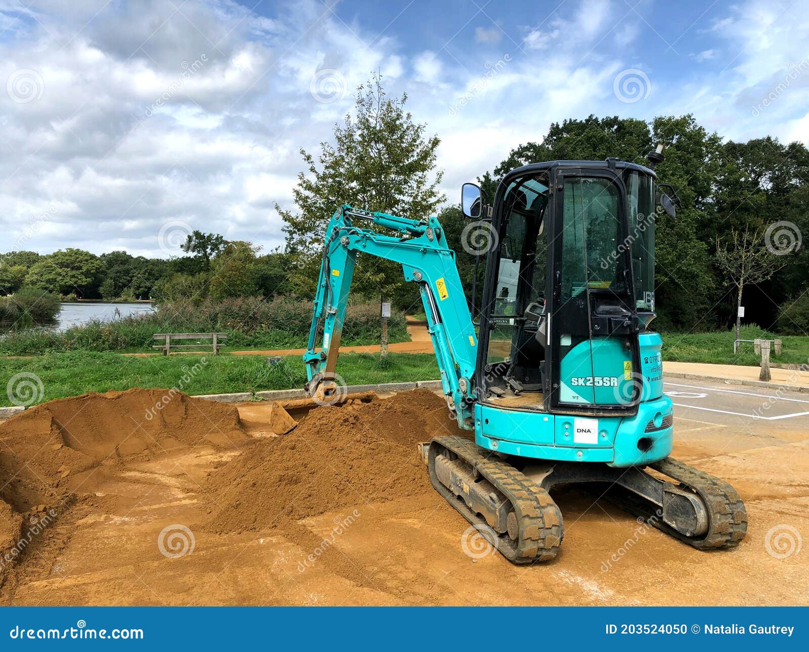 The Modern Mini Blue Excavator Performs Excavation Work Editorial Image ...