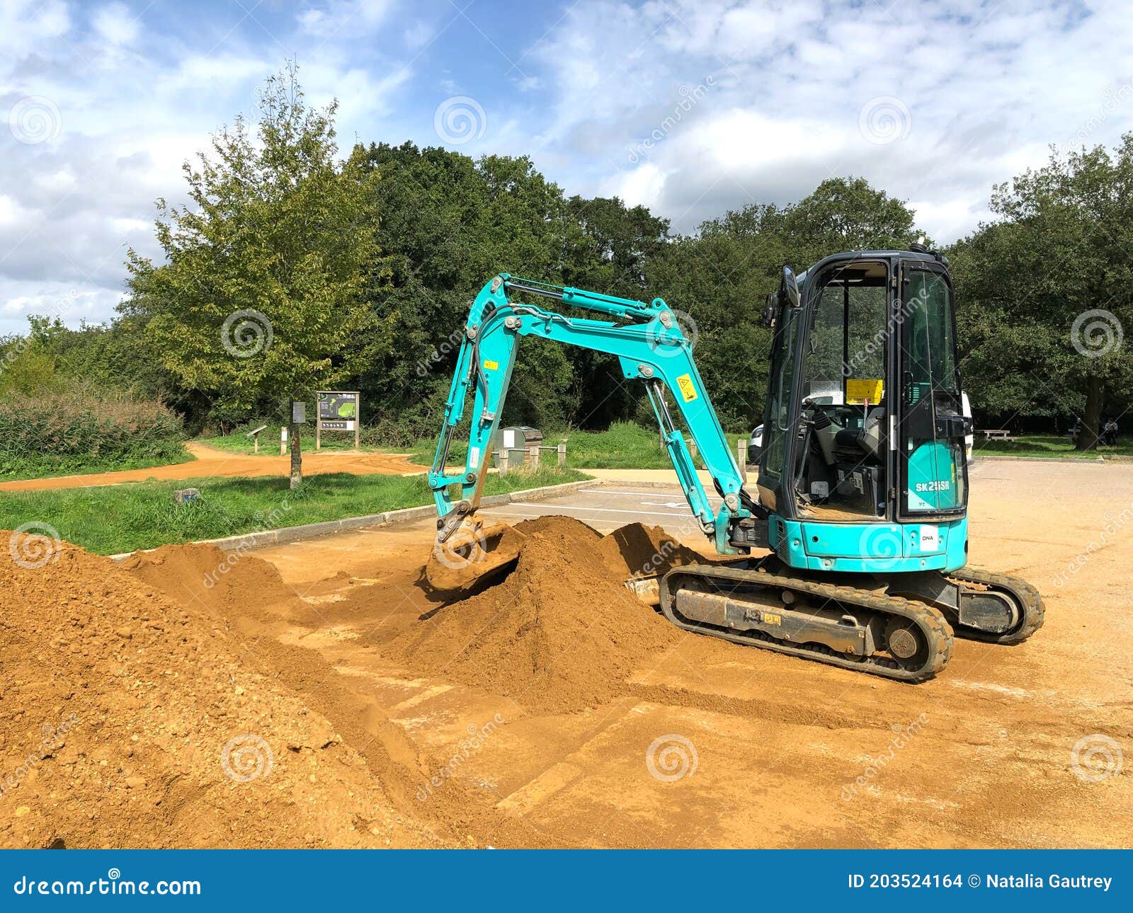 The Modern Mini Blue Excavator Performs Excavation Work Editorial Stock ...