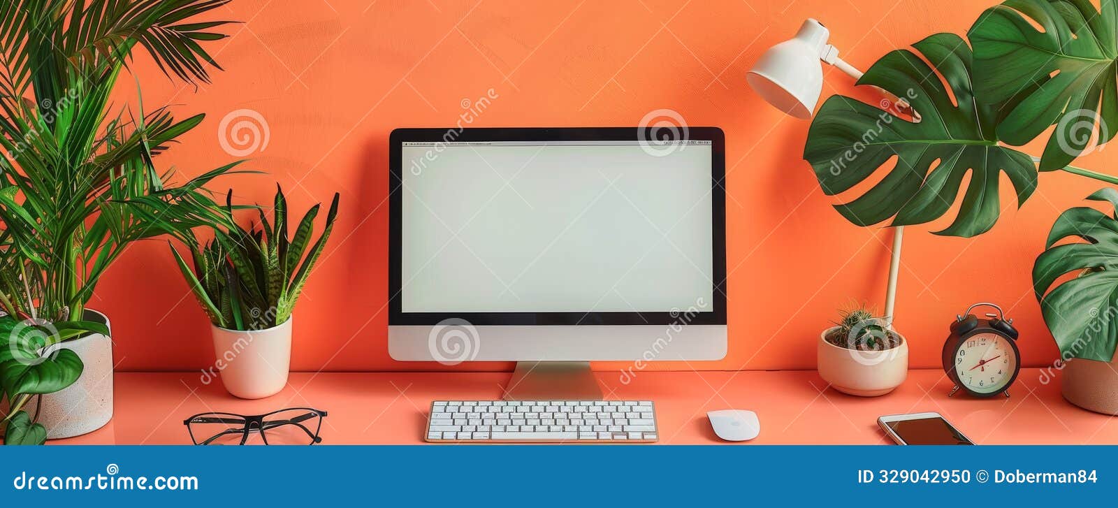 Modern Minimalist Workspace with Computer and Greenery on Orange Desk ...