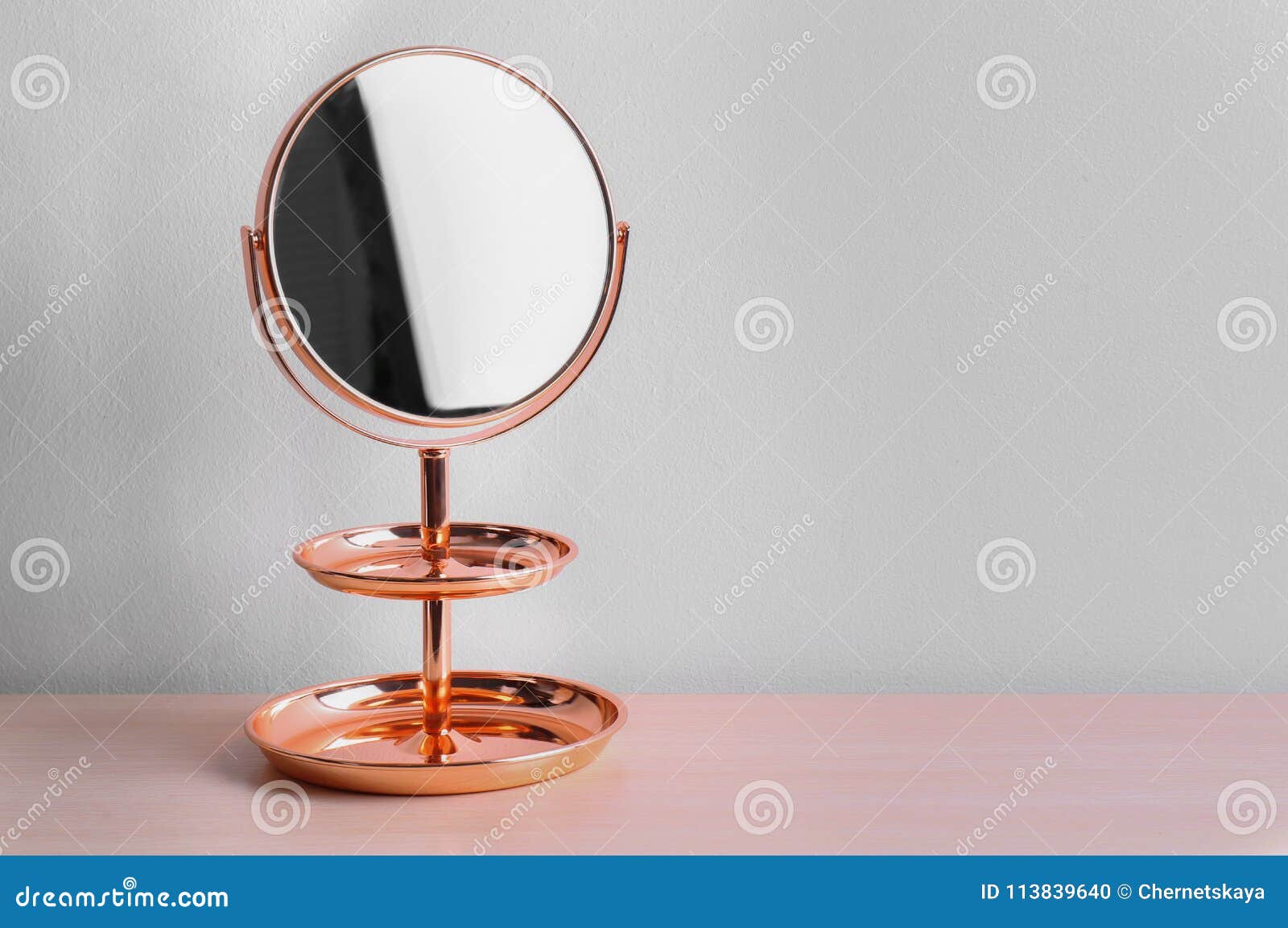 Modern mirror on table stock photo. Image of reflection - 113839640