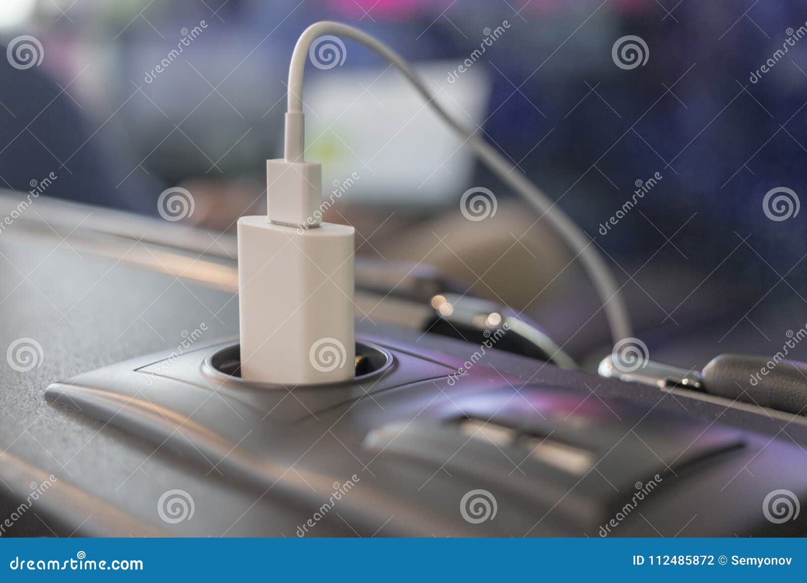 Modern Mobile Phone Charger Plugged on Electric Socket in Airport Stock ...