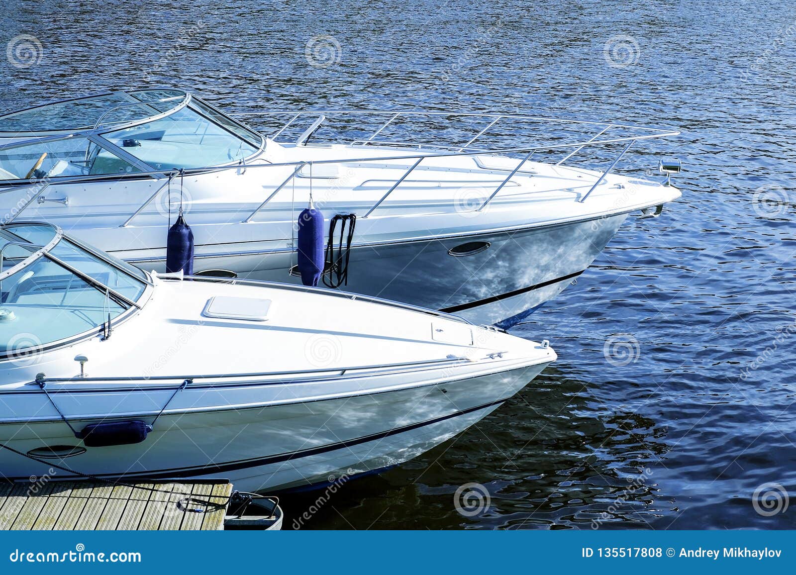 Modern Motor Boats on the Water. Moored on the Water at the Pier Stock ...