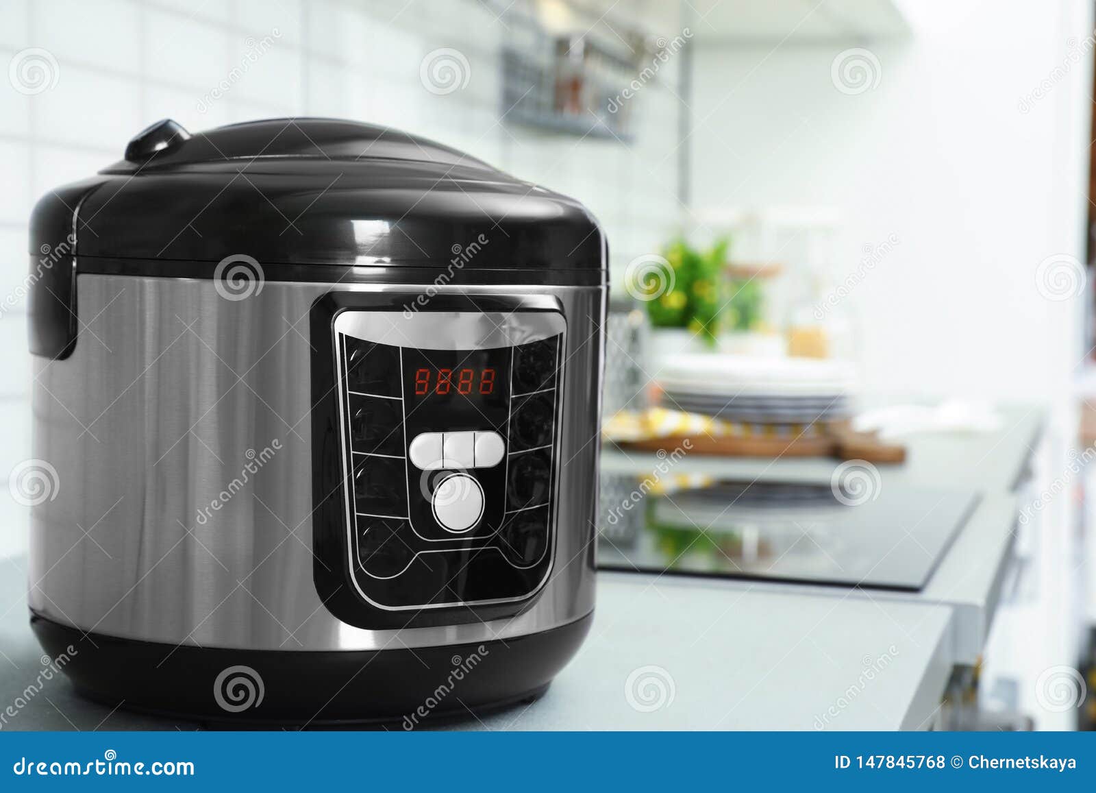 Modern Multi Cooker on Table in Kitchen Stock Photo - Image of blurred ...