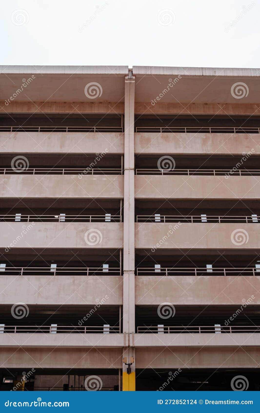 A Tall Parking Garage in an Apartment Complex with Multiple Balconies ...