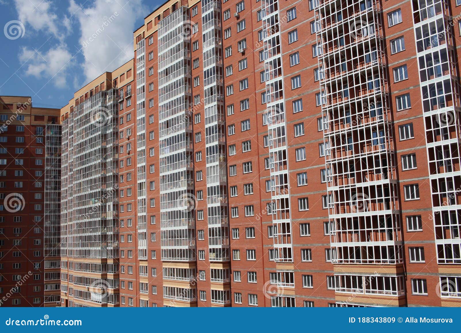 Modern Multi-storey Brick Residential Building with Windows on the ...