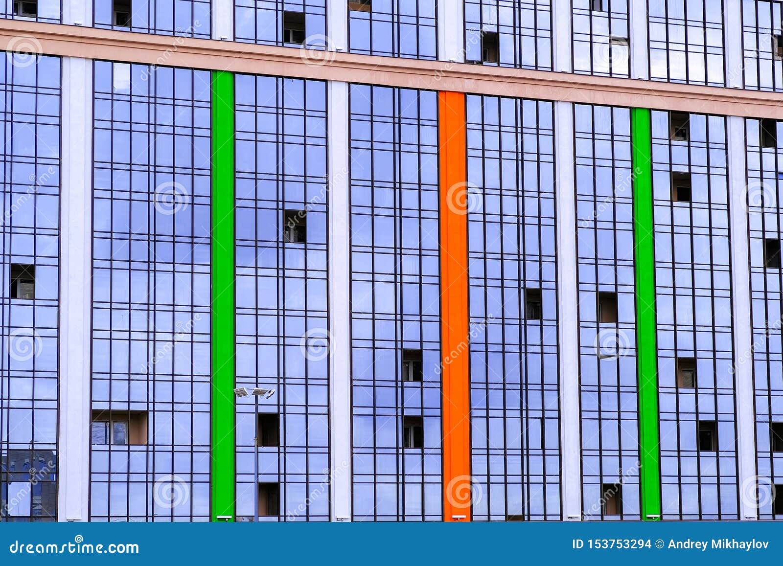 Modern Multi-storey Building with a Glass Facade. the Evening Sunset ...