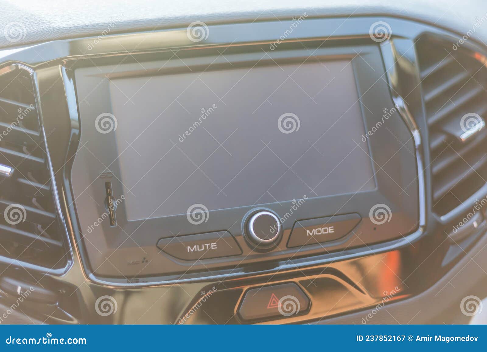 A Modern Multimedia Panel with a Screen and Control Buttons in the Car ...