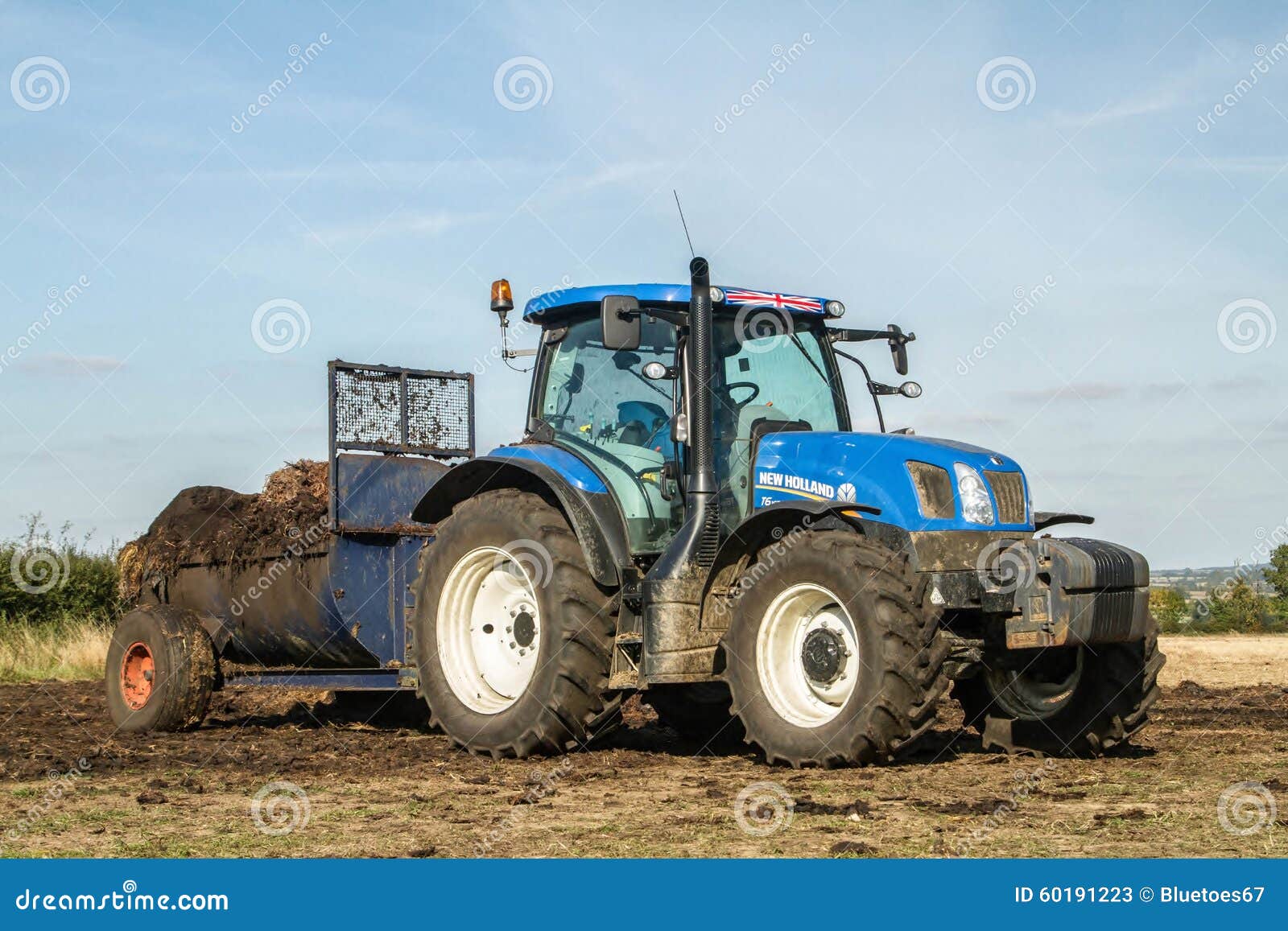 Modern New Holland Tractor Tractor Spreading Manure on Fields Editorial ...