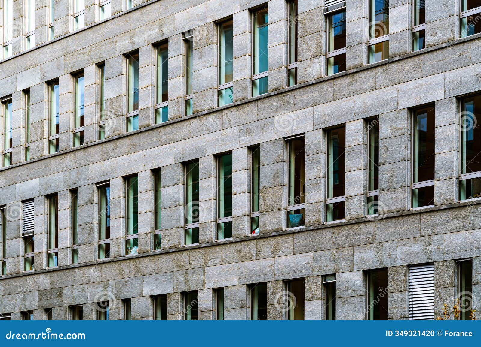 Modern Office Building Facade with Repetitive Windows and Stone ...