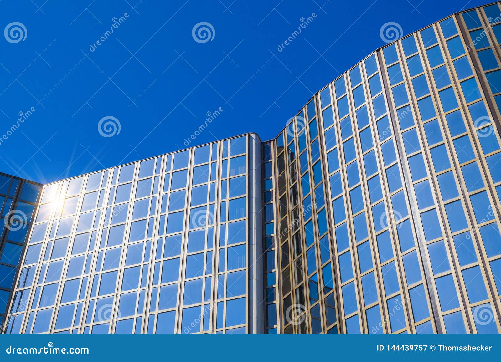 Modern Office Building with Glass Facade in Front of Blue Sky Stock ...