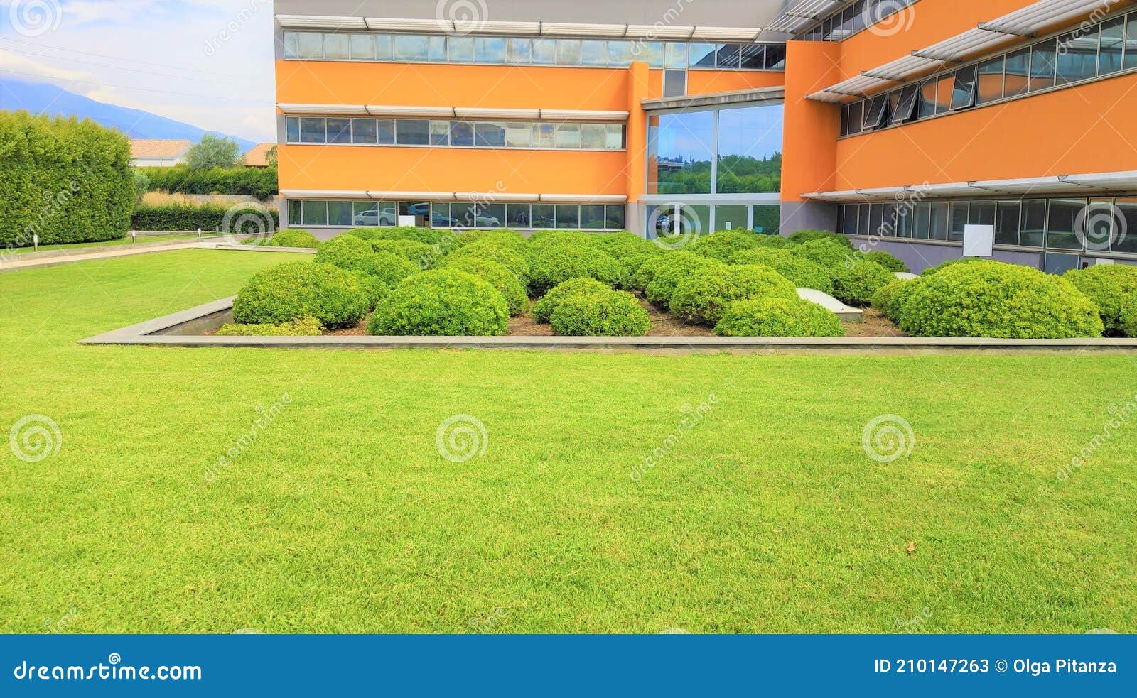 Modern Office Building with a Huge Green Grass Lawn. Very Large Front ...