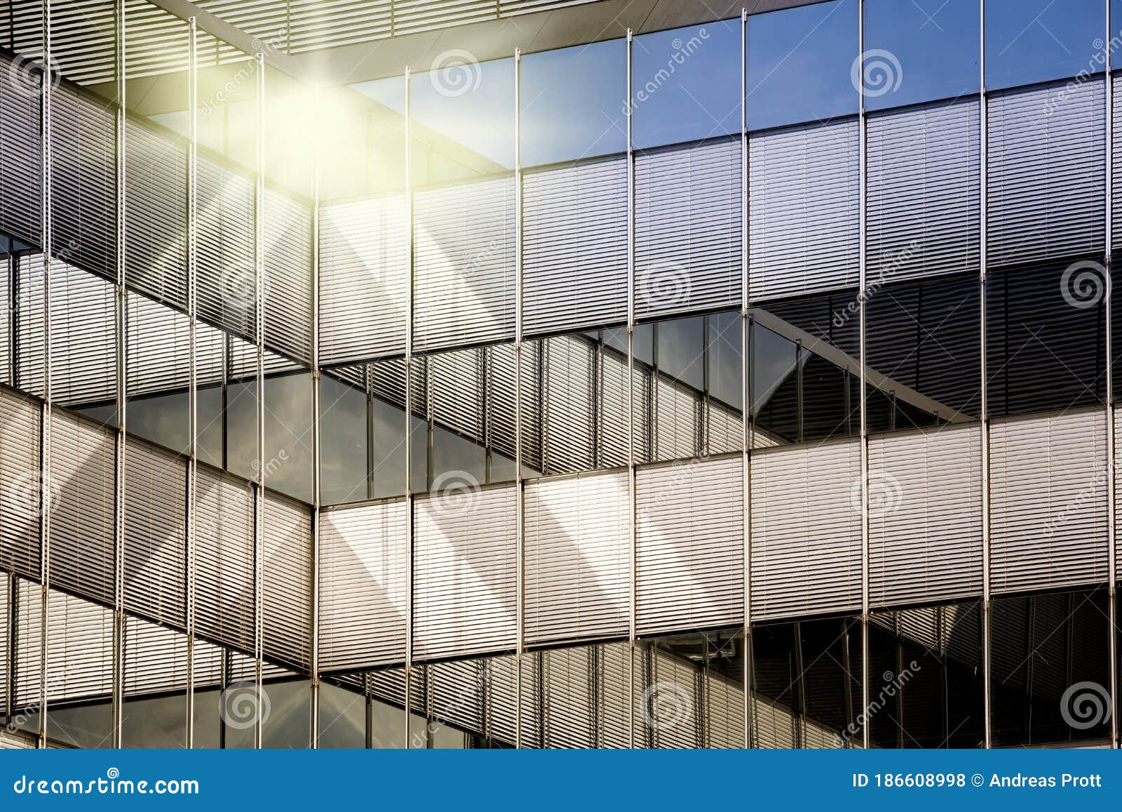 A Modern Office Building with Sun Blinds Down and a Reflective Facade ...