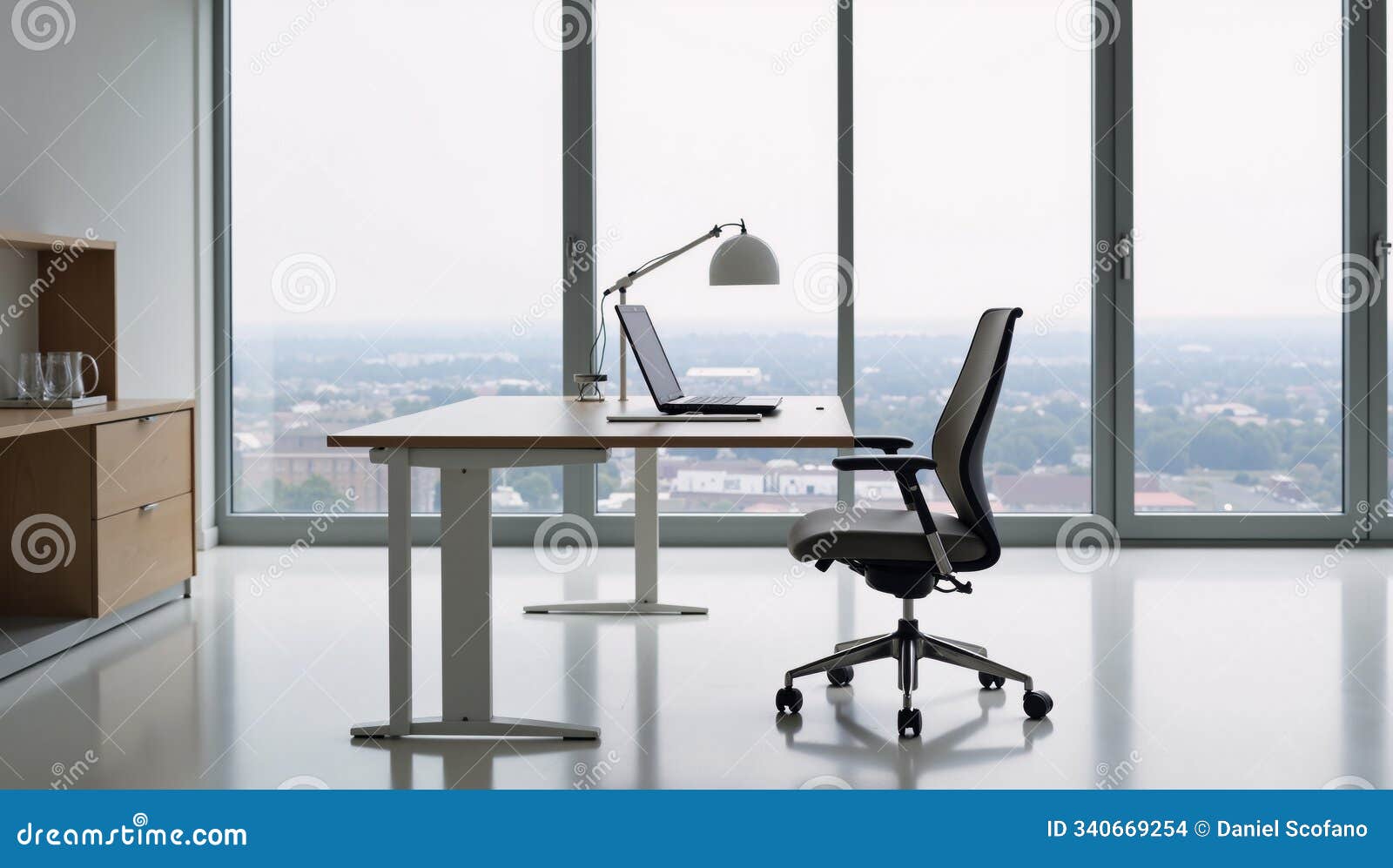 A Modern Office Environment Centered Around a Large Window and Desk ...