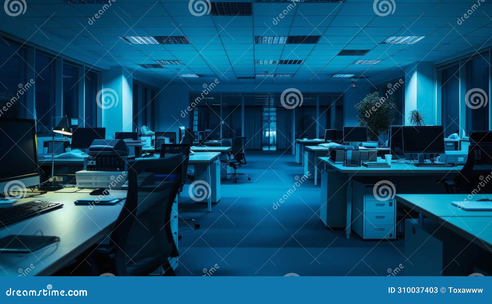 Modern Office Interior at Night with Computers and Desks Stock Image ...