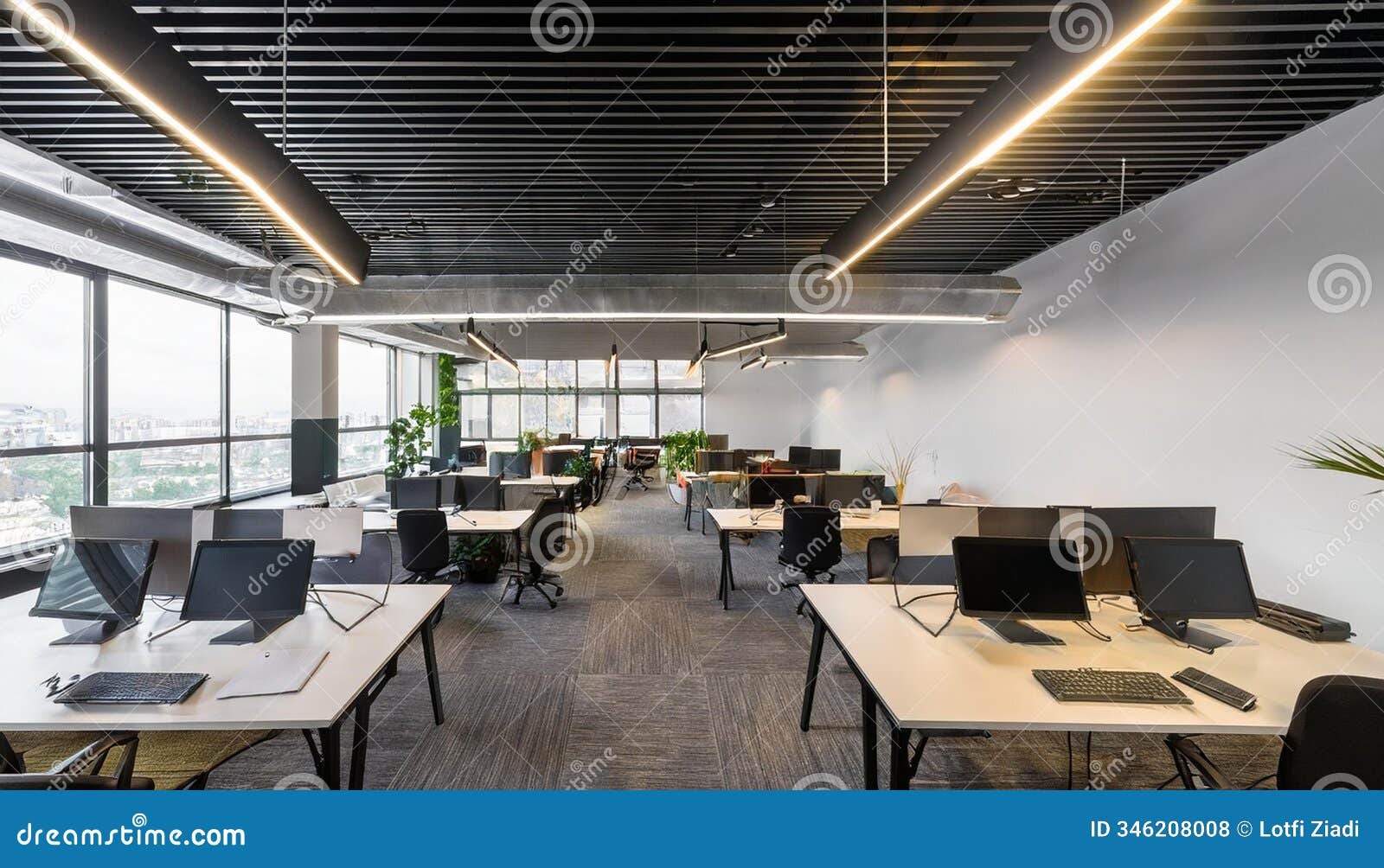Modern Office Interior with Shared Desks, Computers, and Light Fixtures ...