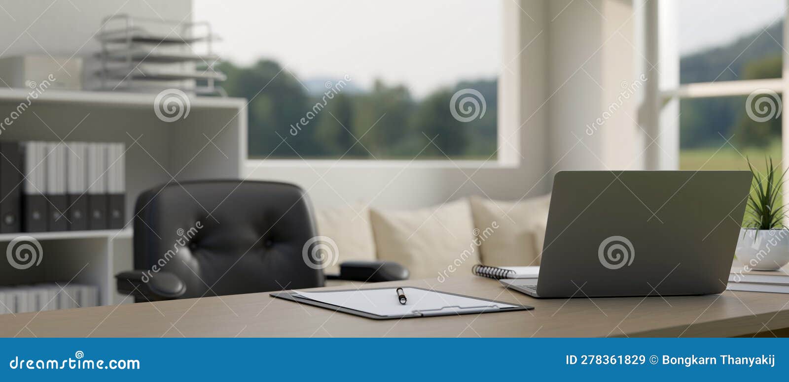 A Modern Office with Laptop Computer, Office Supplies and Decor on a ...