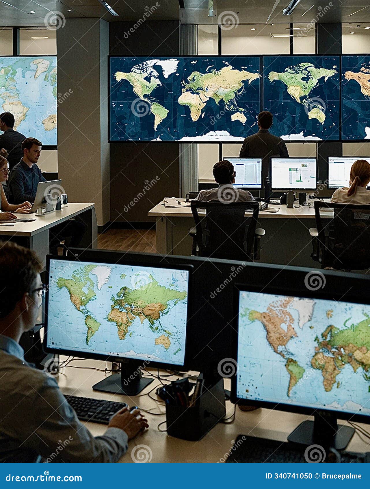 A Modern Office with People Working on Computers. a Large Screen with a ...