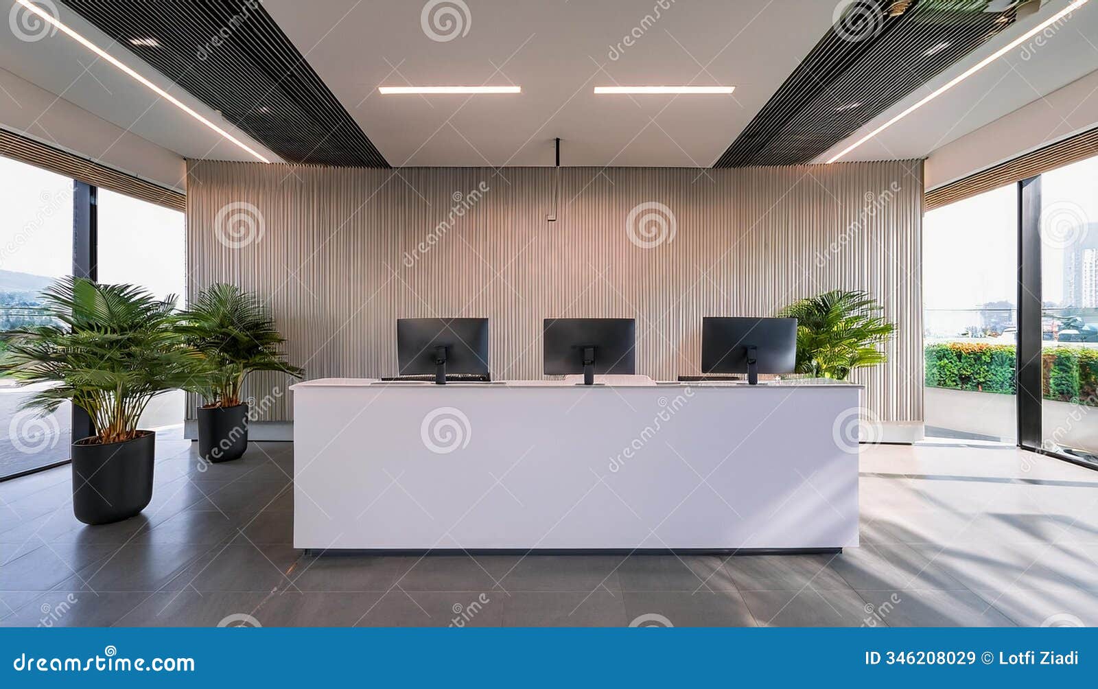 Modern Office Reception with Light Interior, Featuring Computers on a ...