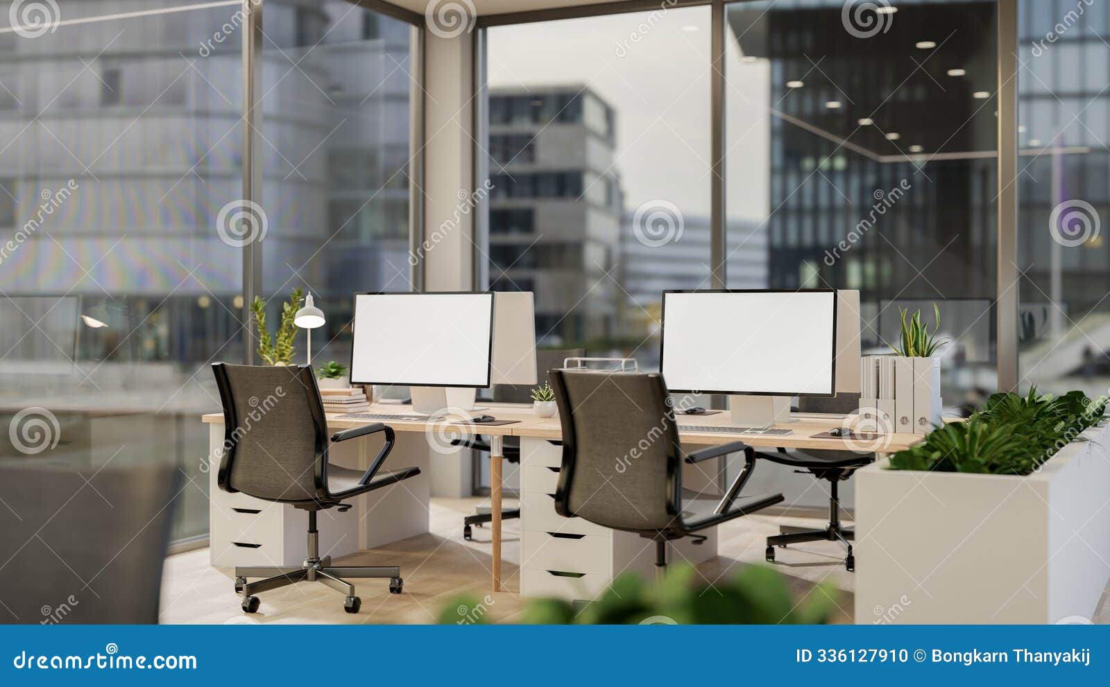 A Modern Office in a Skyscraper Features Computers on Desks by the ...