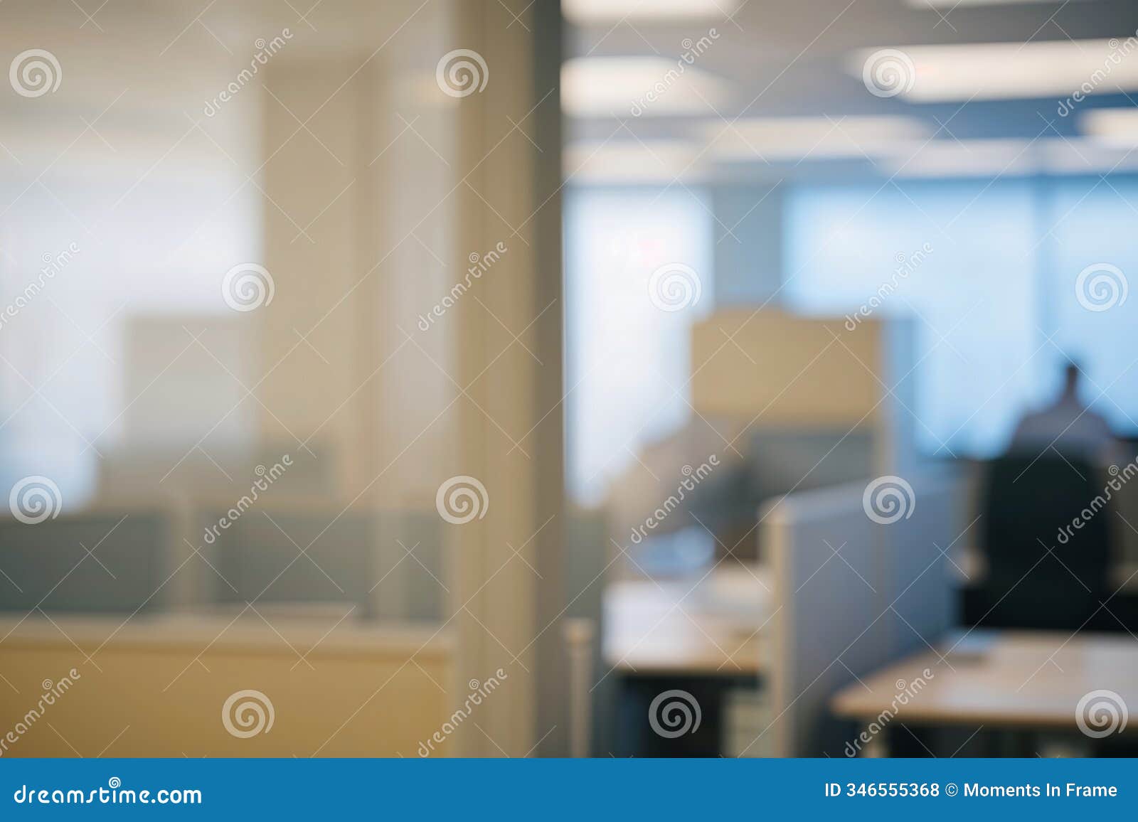 Modern Office Space with Cubicles and Natural Light during a Busy ...