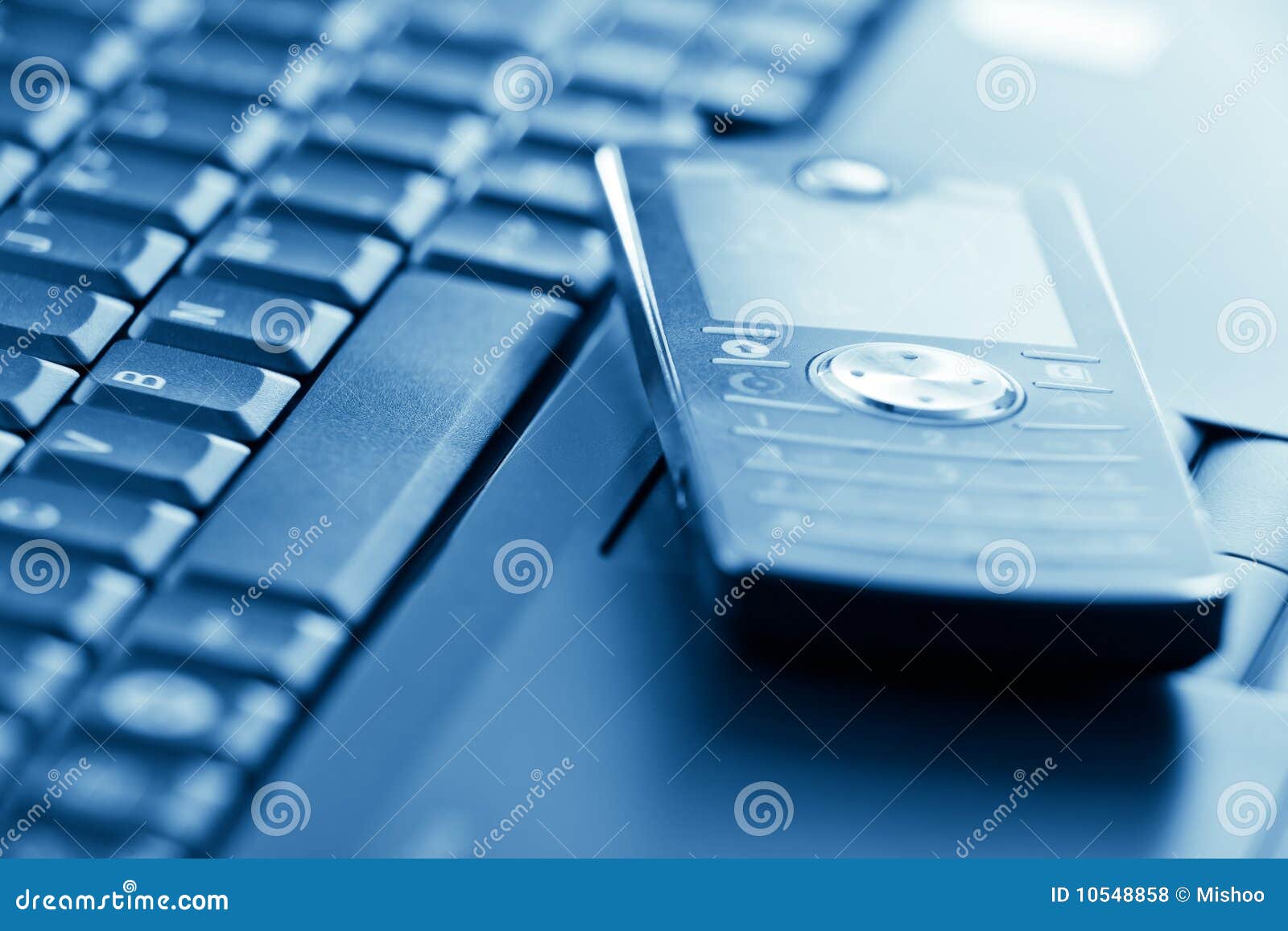 Modern phone on keyboard stock photo. Image of wireless - 10548858