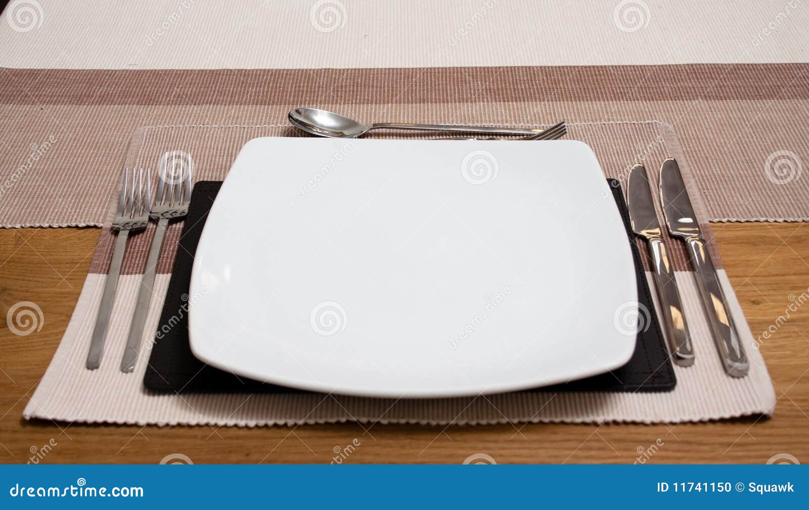 A modern place setting stock photo. Image of spoon, cutlery - 11741150