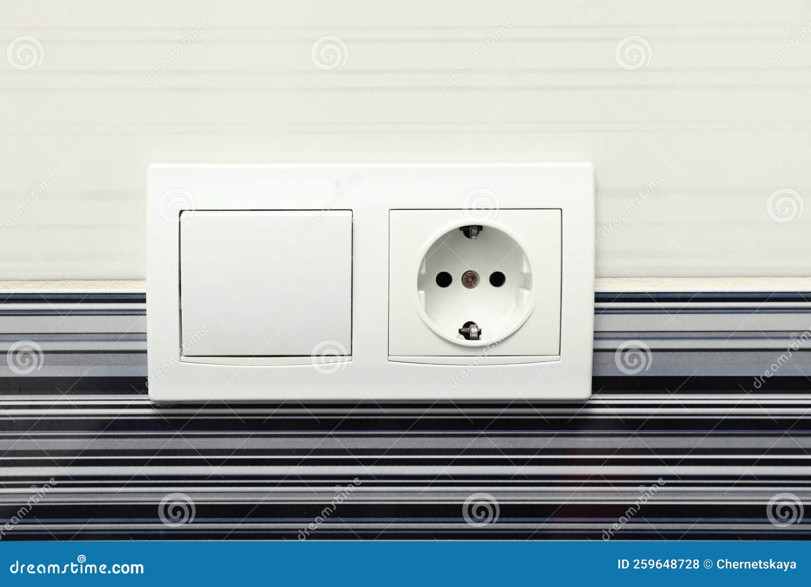Modern Plastic Light Switch and Socket on Color Wall, Closeup Stock ...
